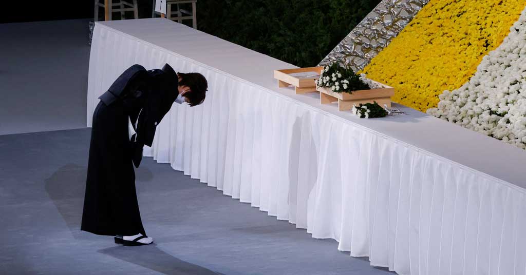 With flowers and a gun salute, Japan bids farewell to Abe at state funeral