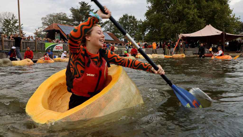Paddle your own pumpkin: racers descend on Belgian pond