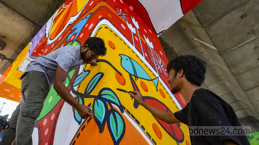 Graffiti decorates Moghbazar flyover pillars