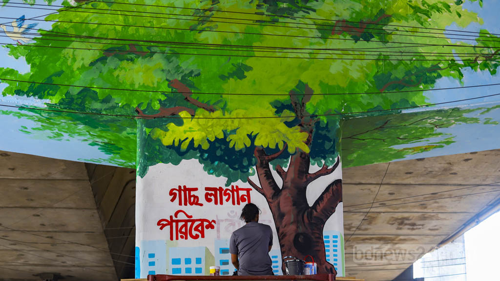 Graffiti decorates Moghbazar flyover pillars