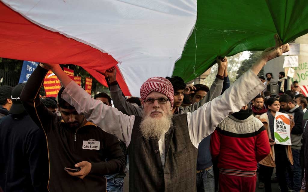 Indian Muslims wave national flag to show protest is not anti-India