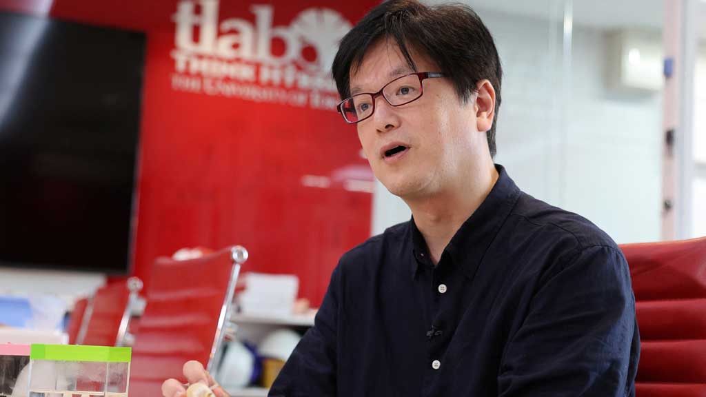 Japanese scientists make robot face 'smile' with living skin